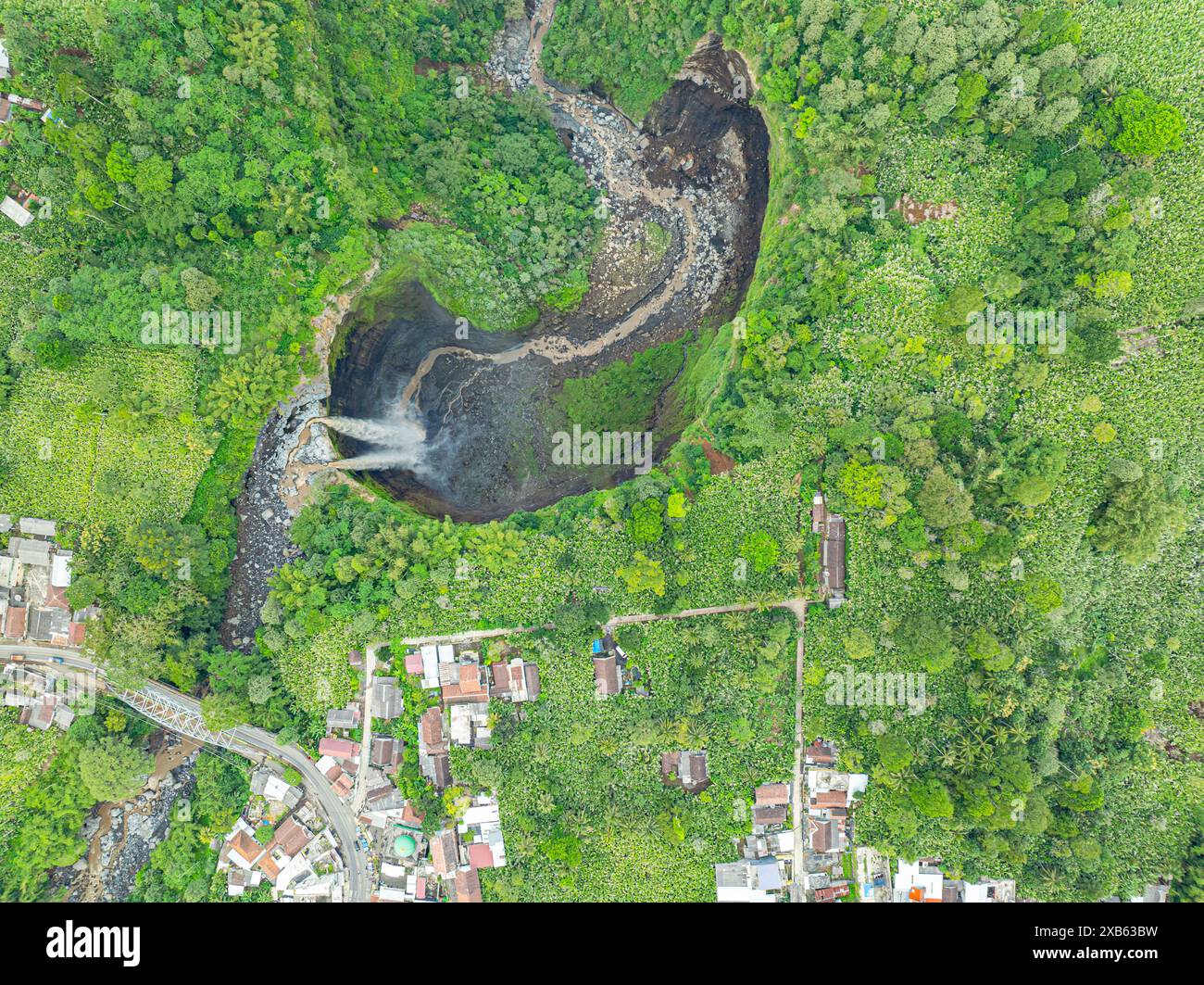 Aerial top view Coban Sriti Waterfall twin Waterfall stream that flows ...