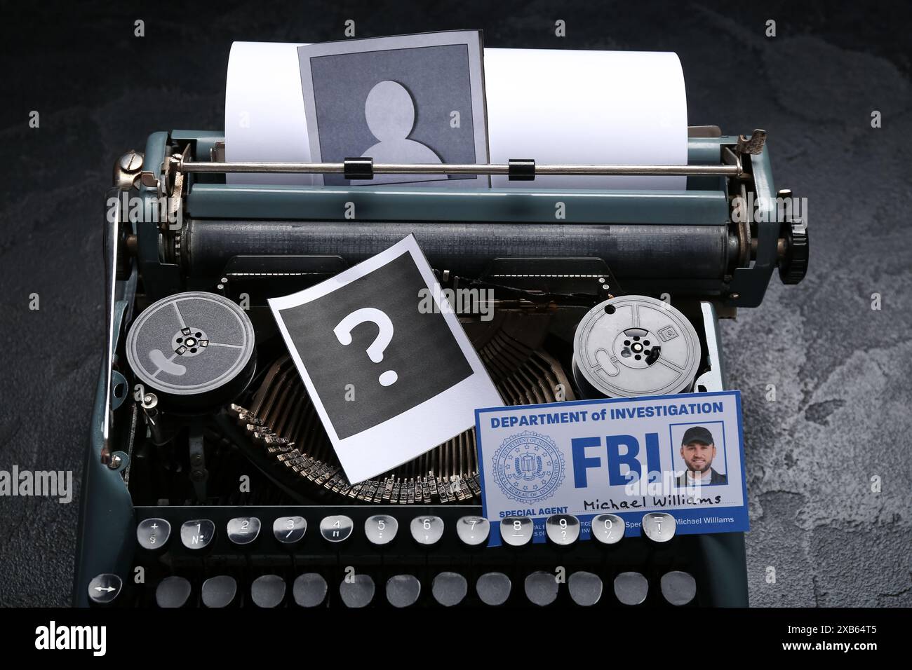 Retro typewriter, document of FBI agent and question mark on dark ...