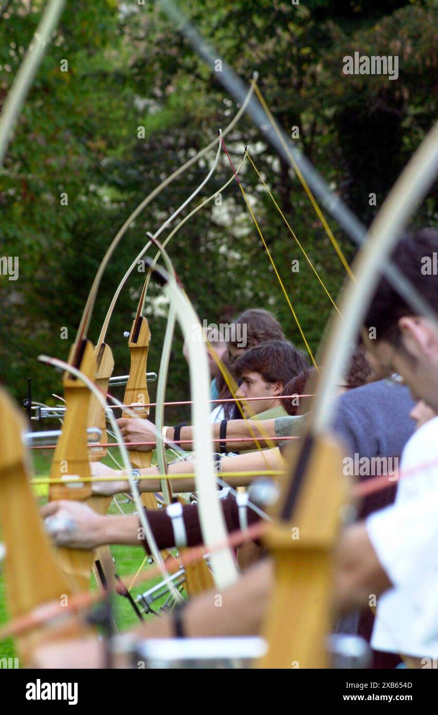 Archer with a bow and arrow aiming in the twilight Archer with bow and ...