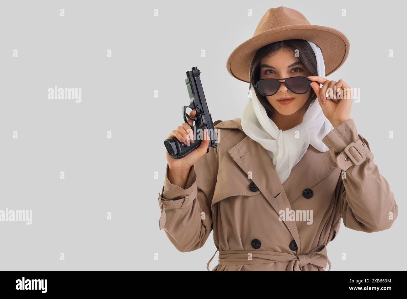 Female spy gun hi-res stock photography and images - Alamy