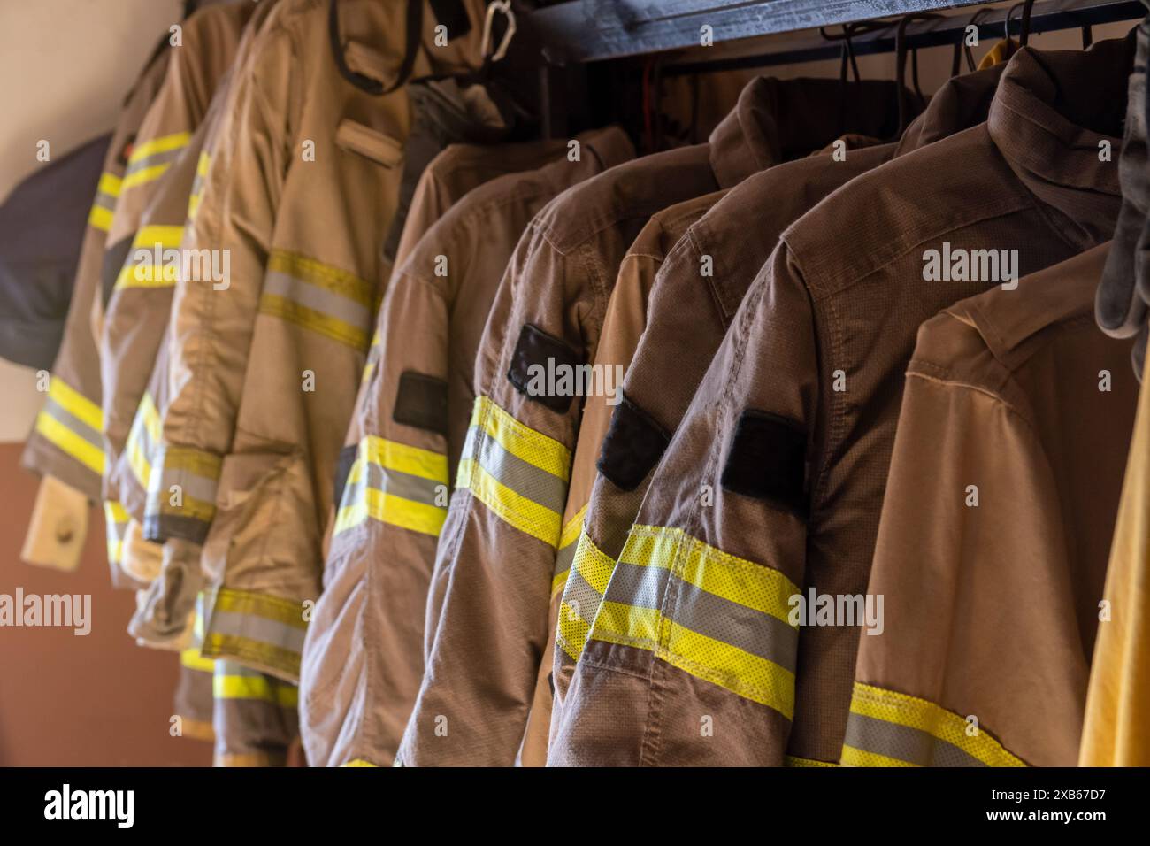 Firefighter's uniforms and gear arranged at fire station Stock Photo ...