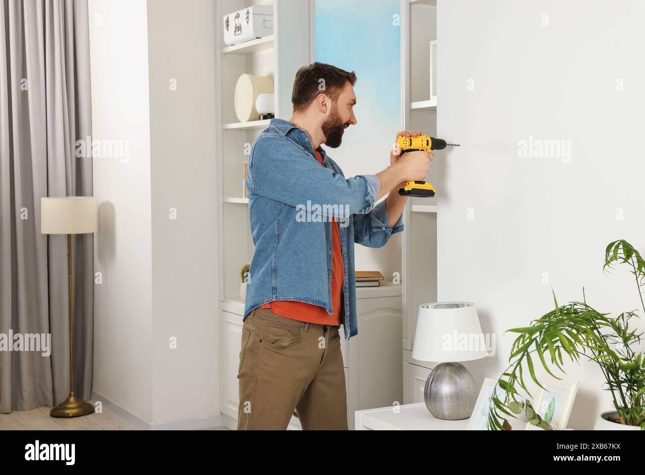 Drill the wall hi-res stock photography and images - Alamy