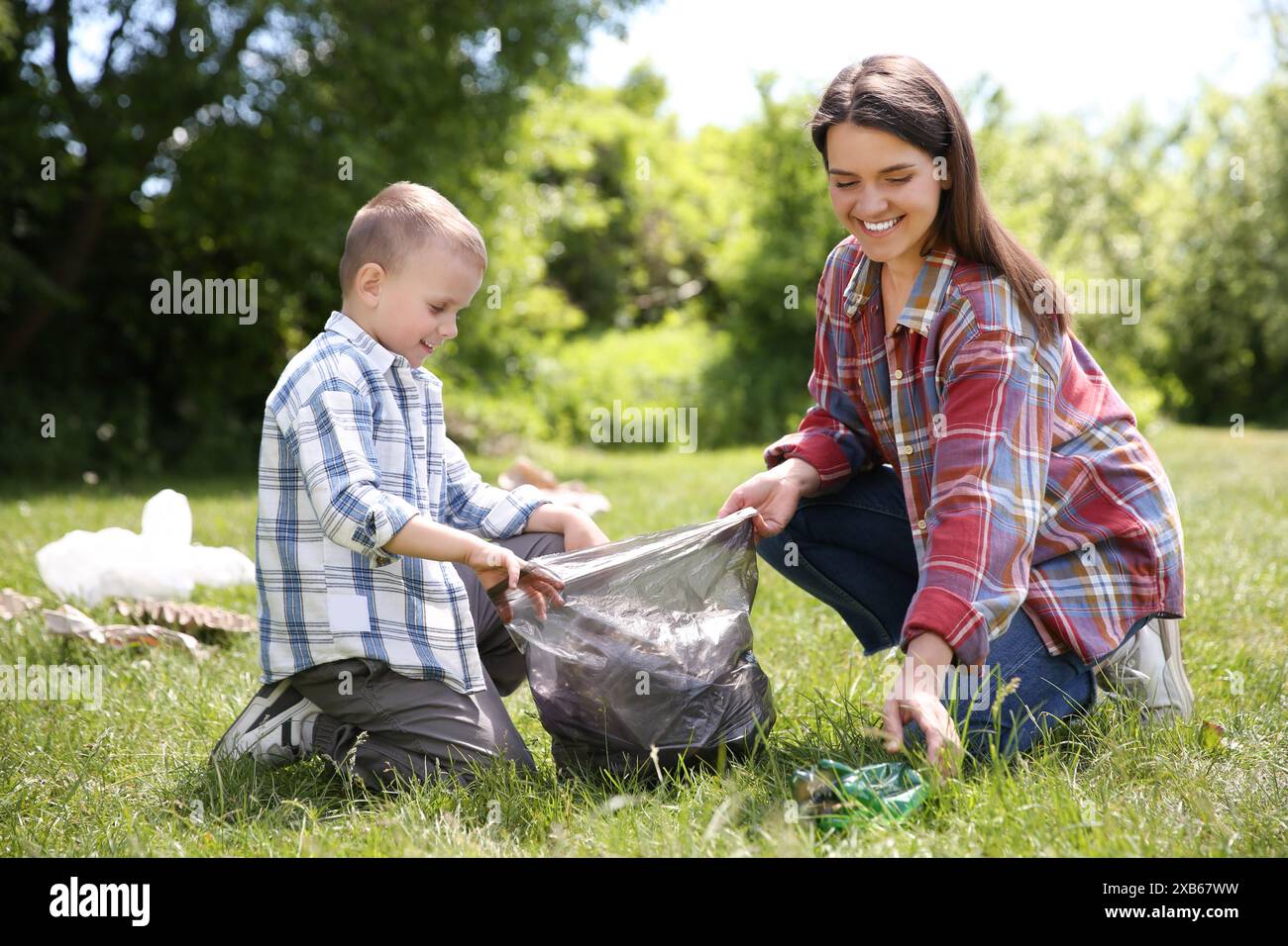 Boy collecting rubbish in plastic hi-res stock photography and images ...