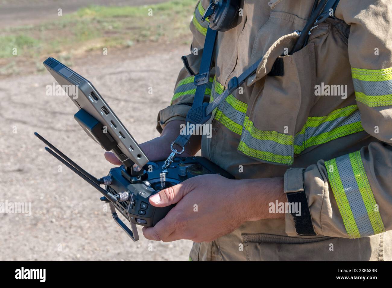 latin firefighter piloting rescue drone Stock Photo - Alamy