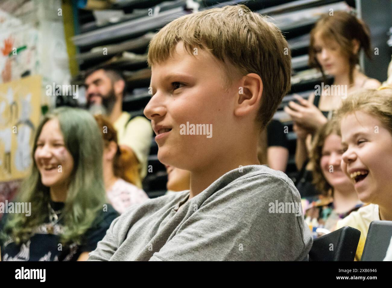 Kharkiv, Ukraine, June 10, 2024 Children attend a music concert of the Ukrainian group "Pyrig ...
