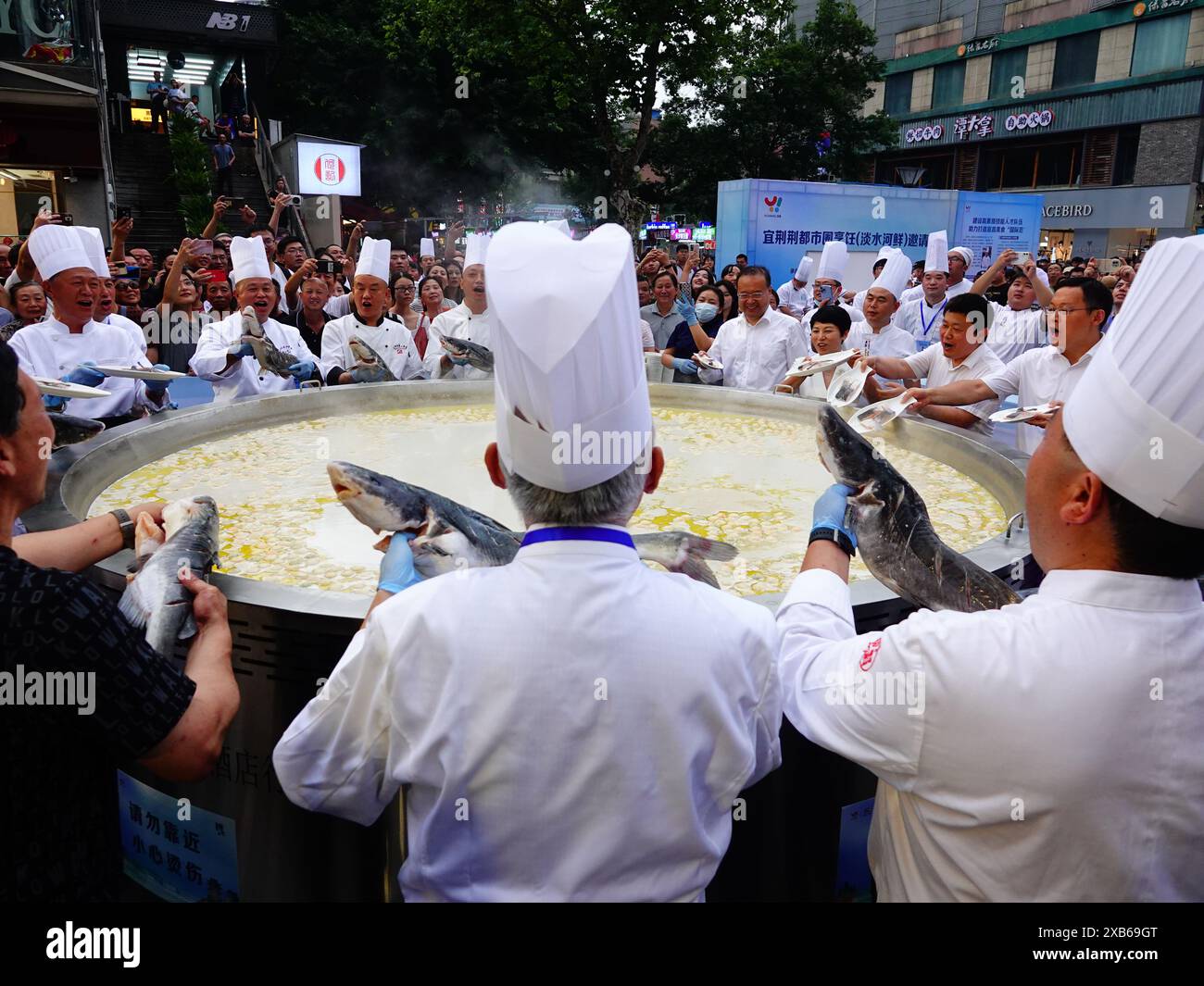 YICHANG, CHINA - JUNE 8, 2024 - Thirteen chefs cook a 3-meter-diameter ...
