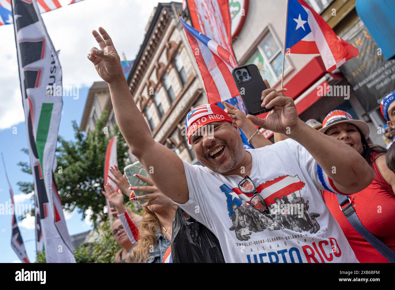 Brooklyn, United States. 09th June, 2024. A man makes a peace sign as ...