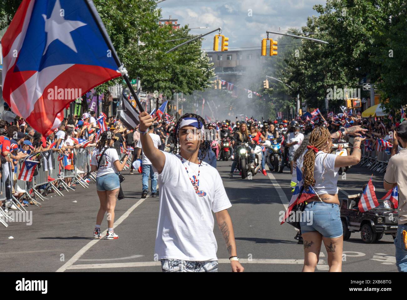 Brooklyn, United States. 09th June, 2024. A man waves a flag in front ...