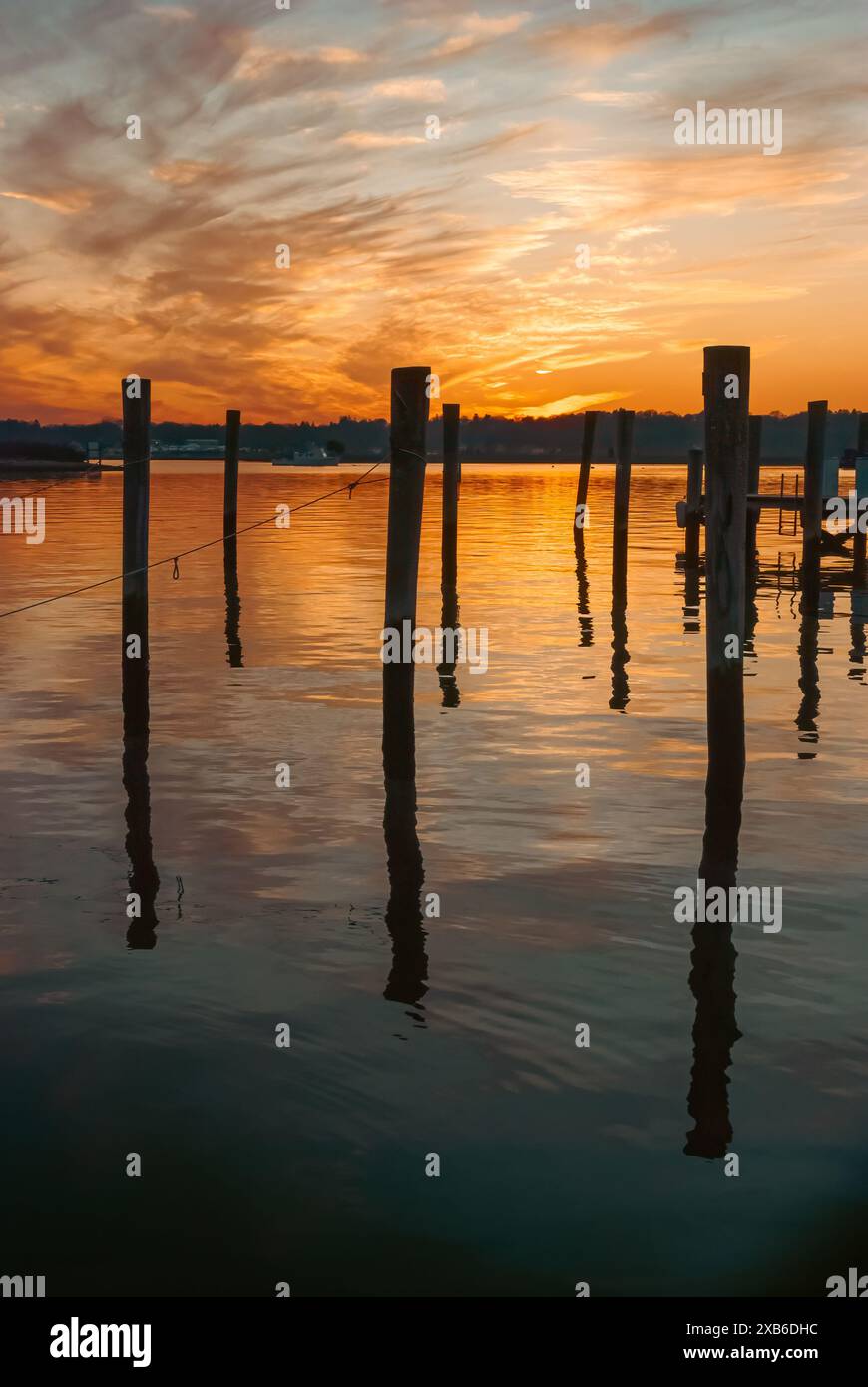 Sunset on the Connecticut shore casts inspiring hues across clouds in a ...