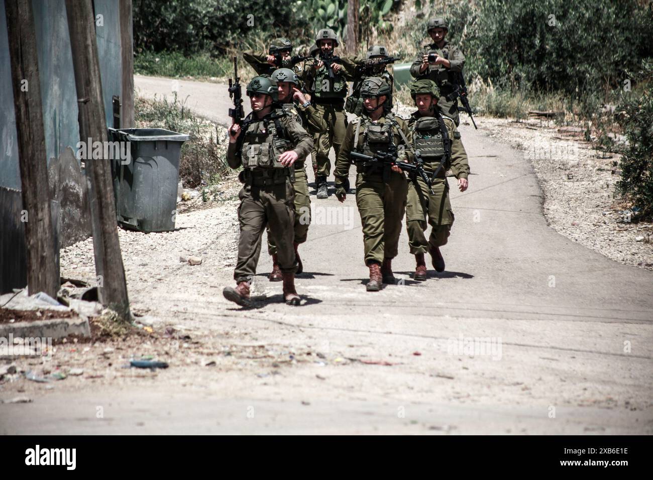 Israeli soldiers take their positions during the military operation. A ...