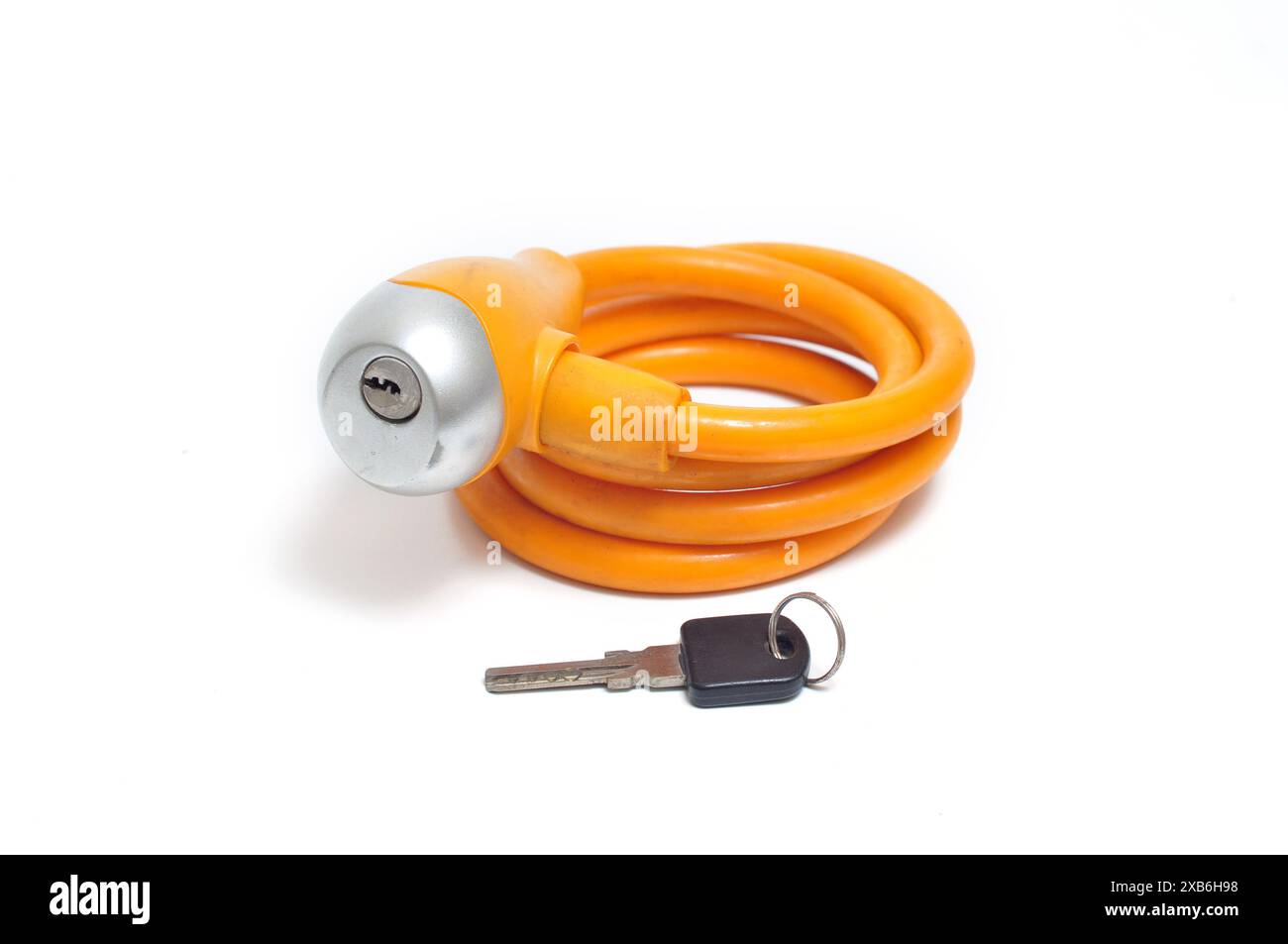 Bicycle lock yellow color and key white background Stock Photo - Alamy