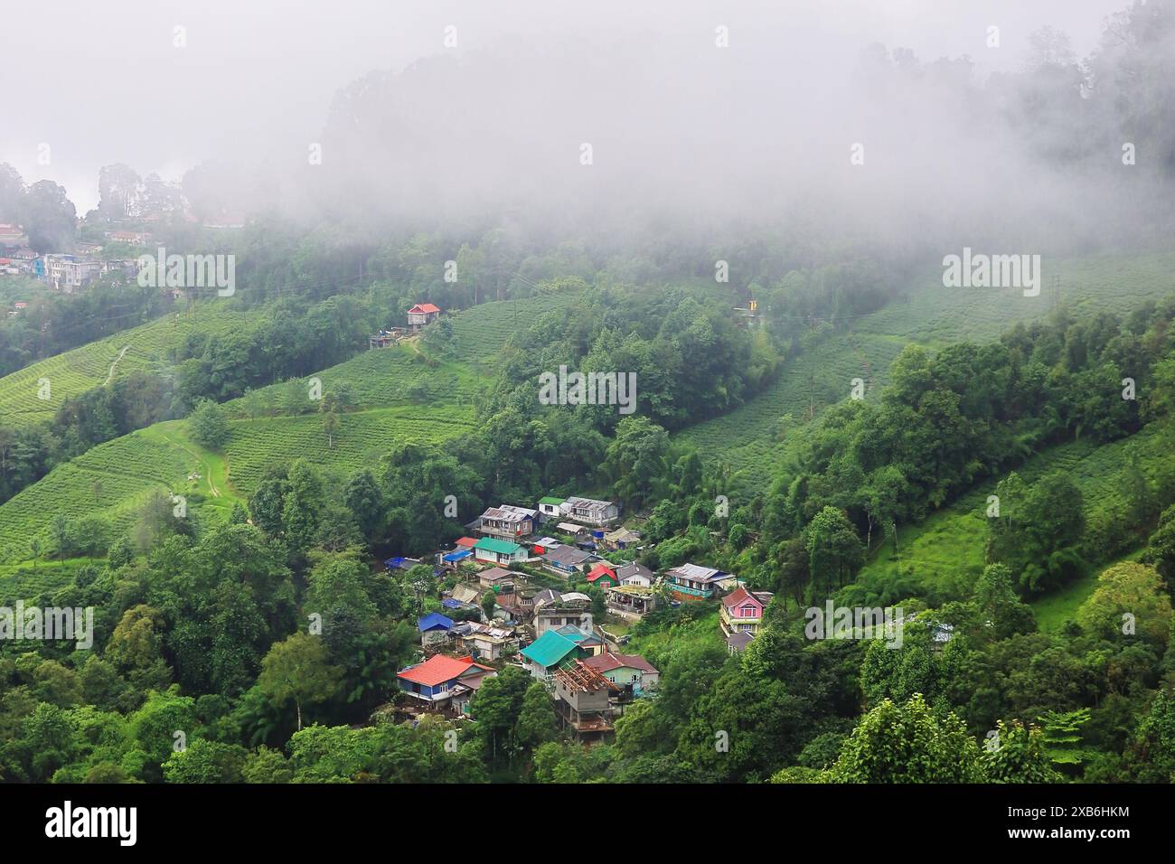 panoramic view of cloudy and foggy lush green himalaya mountains ...