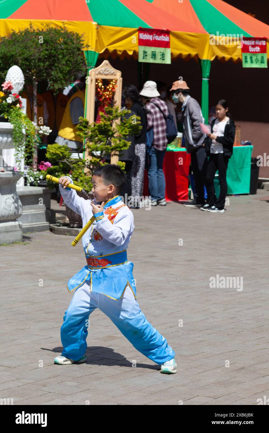 Young boy peforming with Nunchucks at Buddhist Temple in Richmond ...