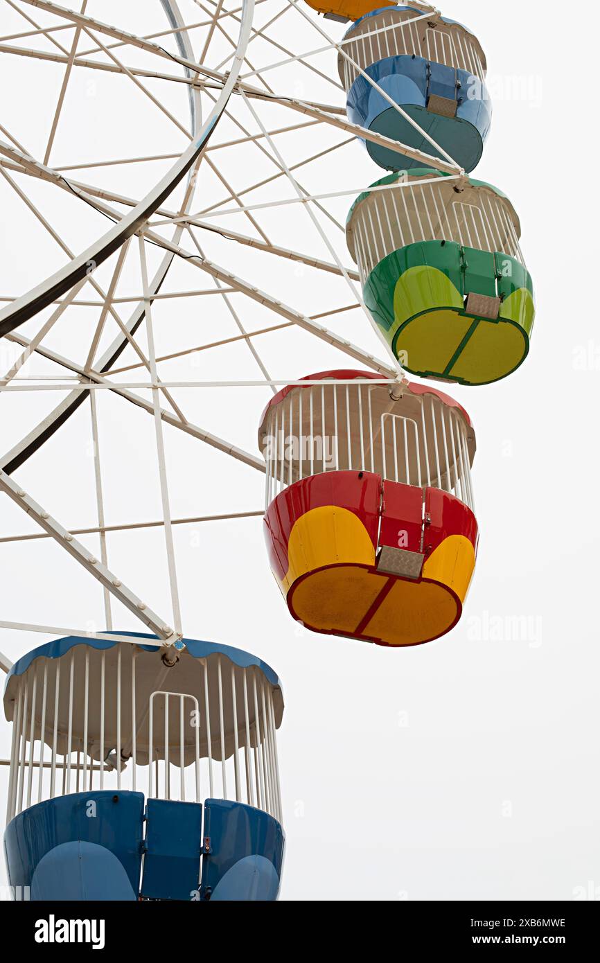 Colourful Ferris Wheel at Luna Park, Sydney against a white sky Stock ...