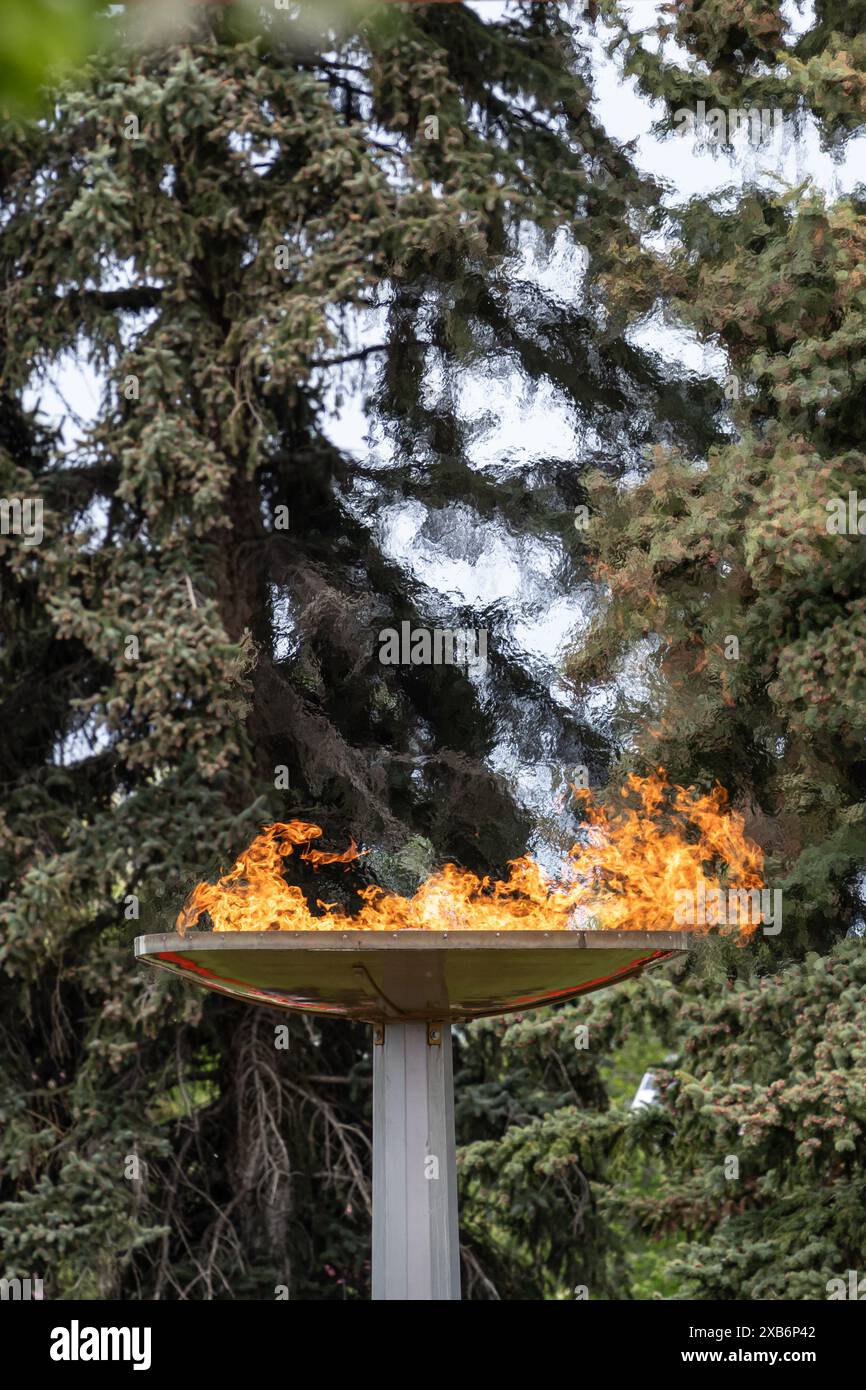 Torch aflame outside at a graduation ceremony Stock Photo - Alamy