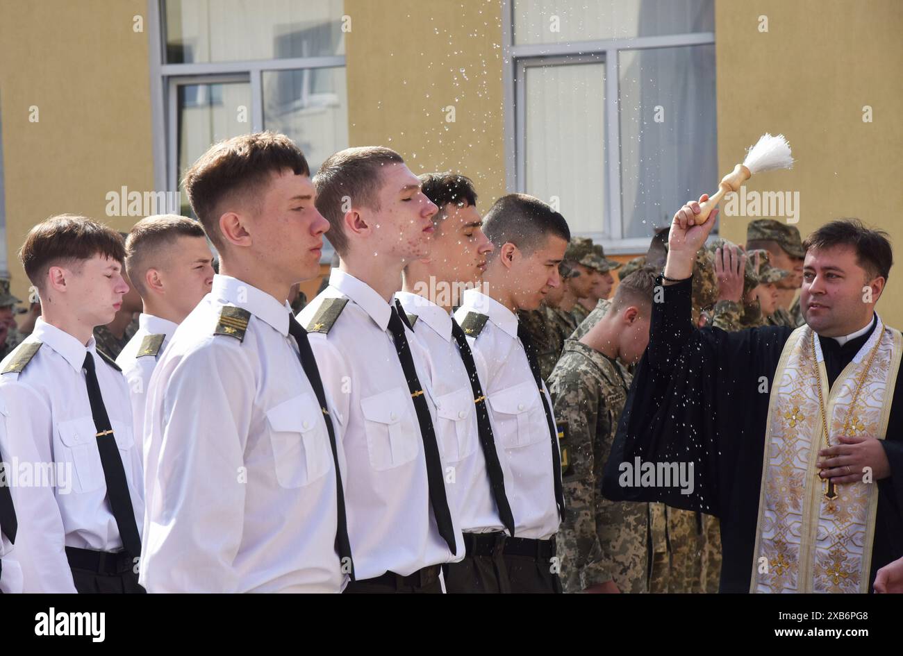 June 8, 2024, Lviv, Ukraine: A priest sprinkles holy water on cadets ...