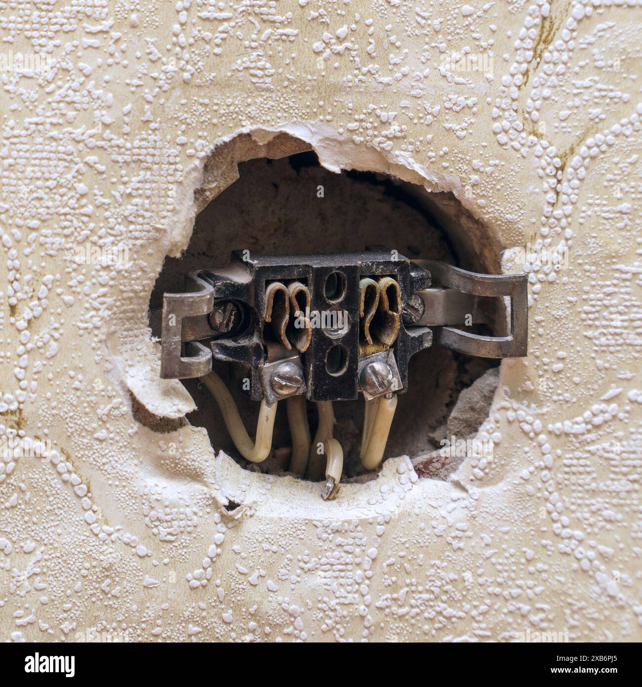 An open old non-working outlet in the wall with wallpaper Stock Photo ...