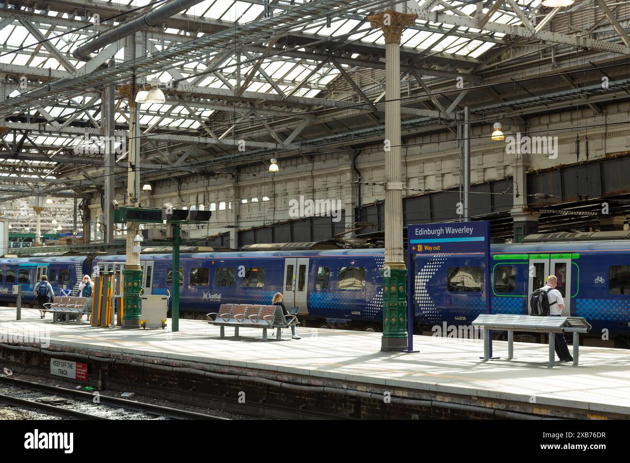 A Scotrail train at a platform at Edinburgh Waverley Train Station ...