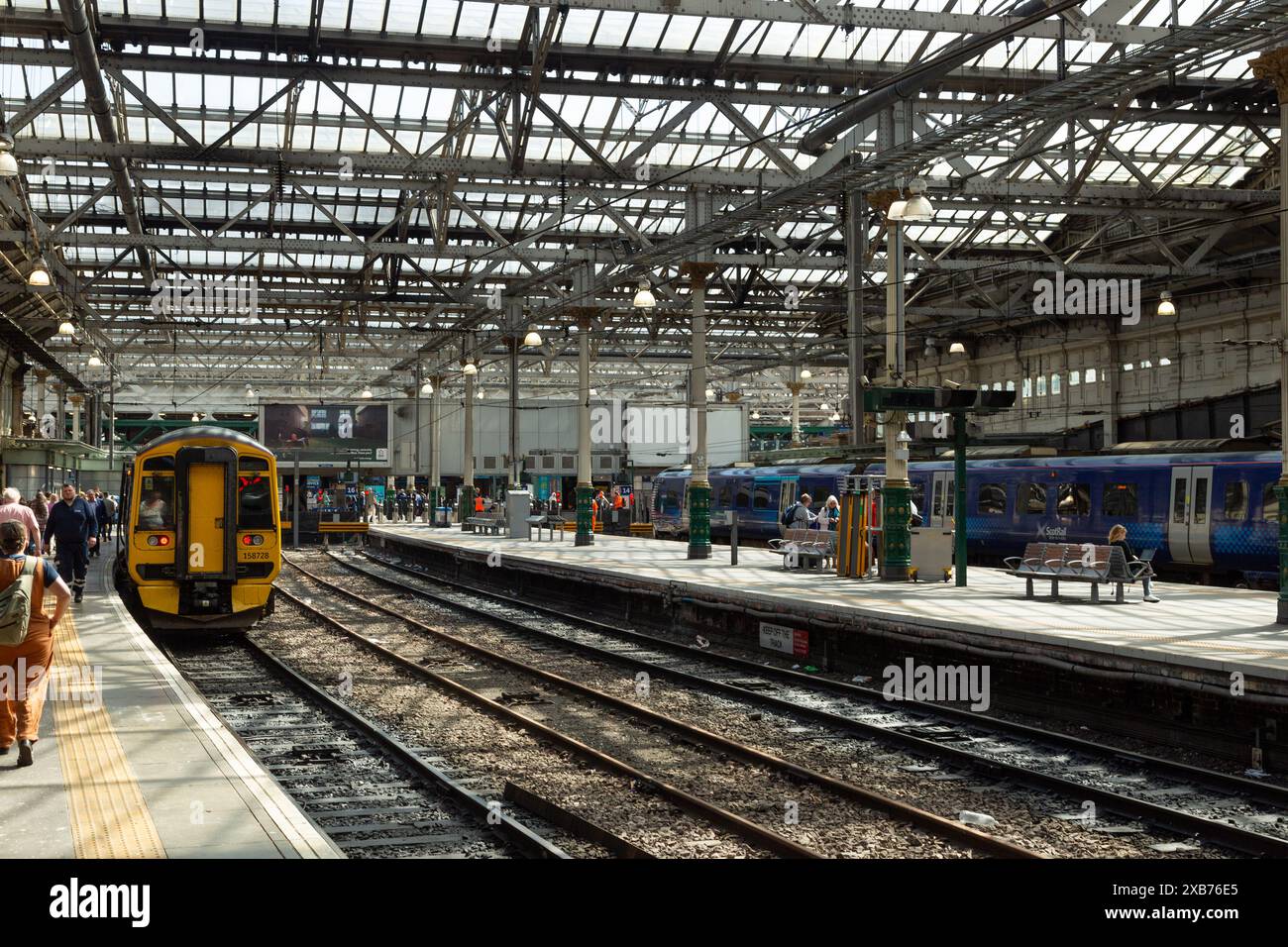 A Scotrail train at a platform at Edinburgh Waverley Train Station ...
