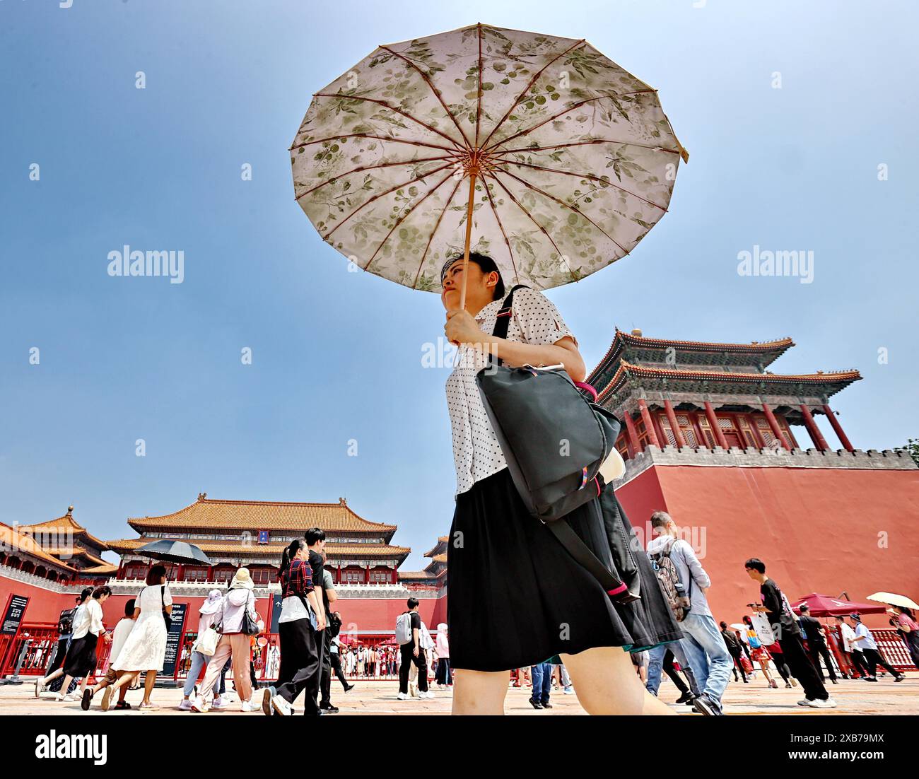 Tourists visit the Palace Museum amid hot weather in Beijing, China, 8 ...