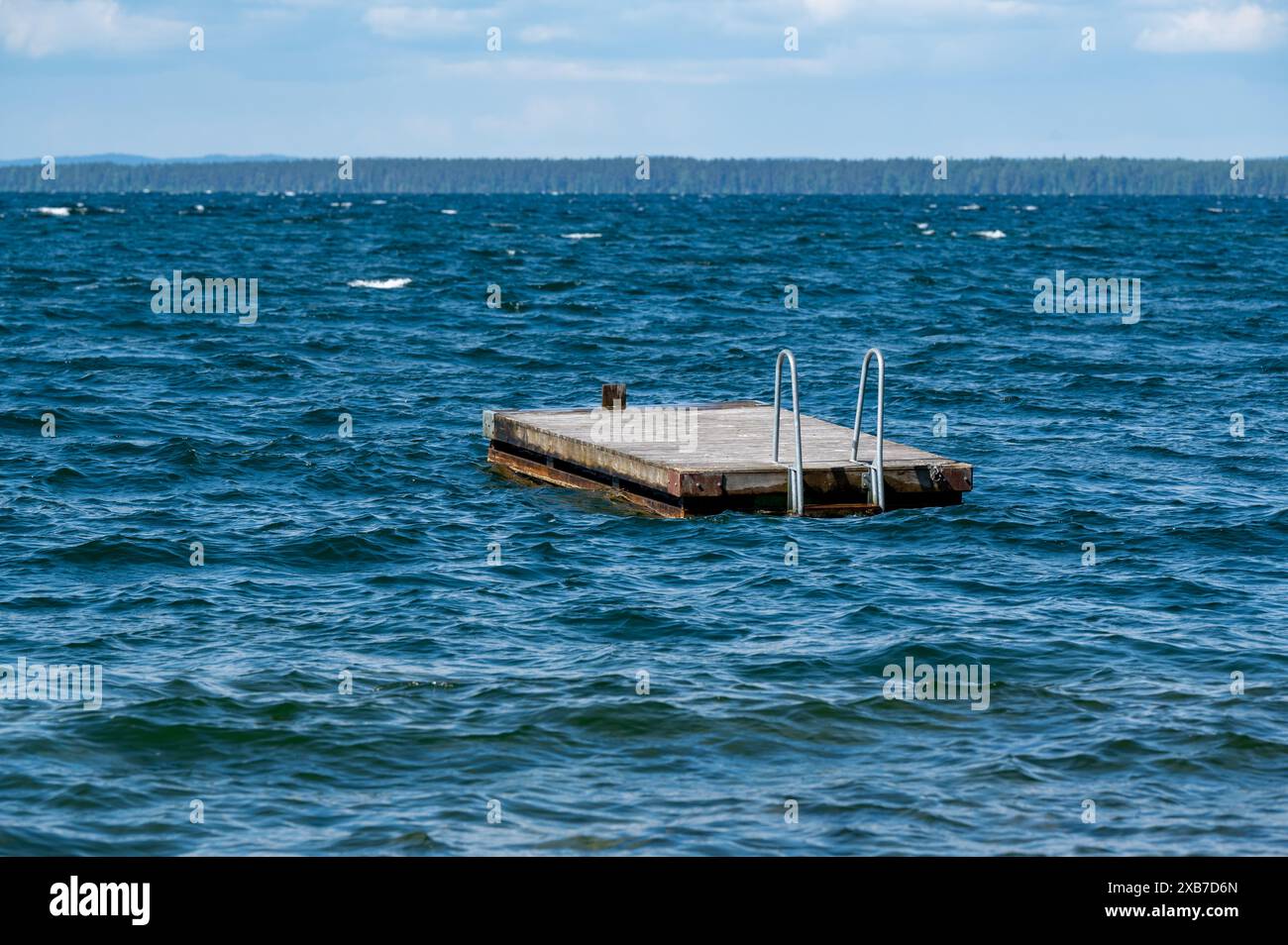 Small wooden jetty raft with ladder for swimmers Stock Photo - Alamy