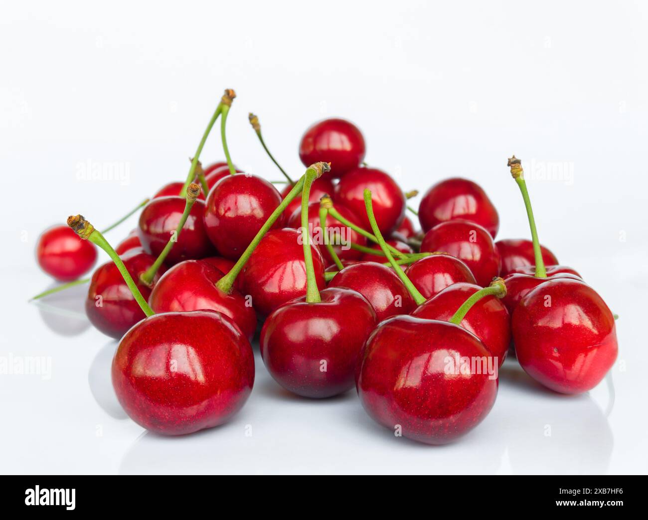 Sweet cherry fruit (Prunus avium) close-up isolated on white background ...