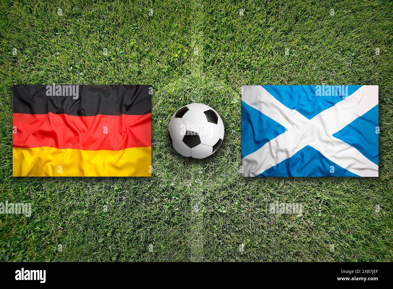 Germany vs. Scotland flags on green soccer field Stock Photo - Alamy