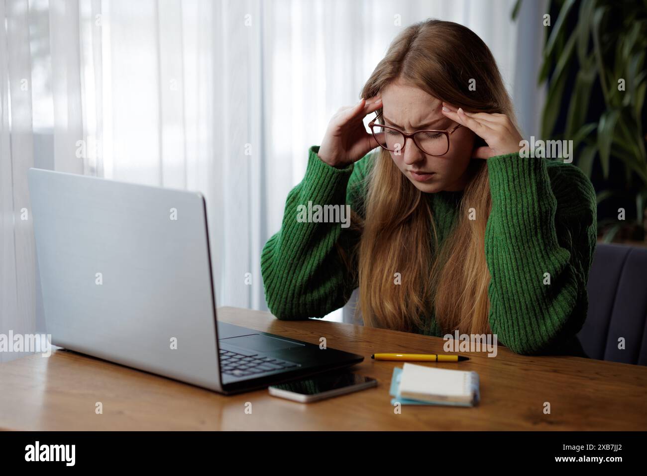 Woman wearing cozy green sweater hi-res stock photography and images ...