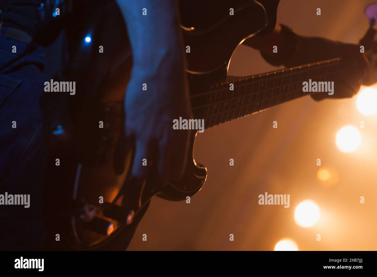 Electric bass guitar player hands, live music theme Stock Photo - Alamy