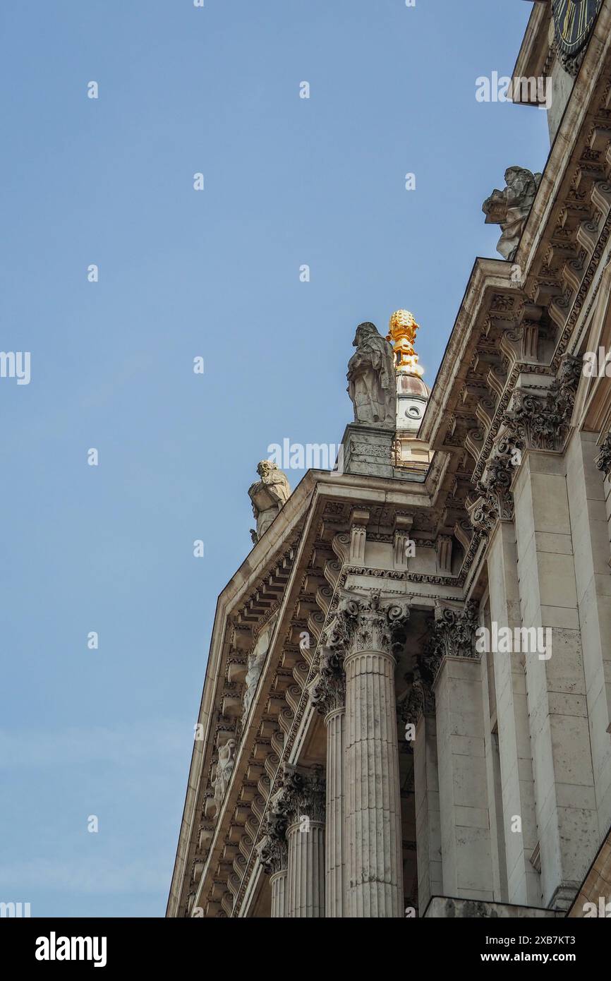 A Detailed architecture of a tall building with statues and sculptures ...