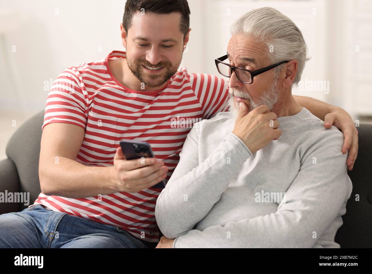 Father using smartphone background hi-res stock photography and images ...