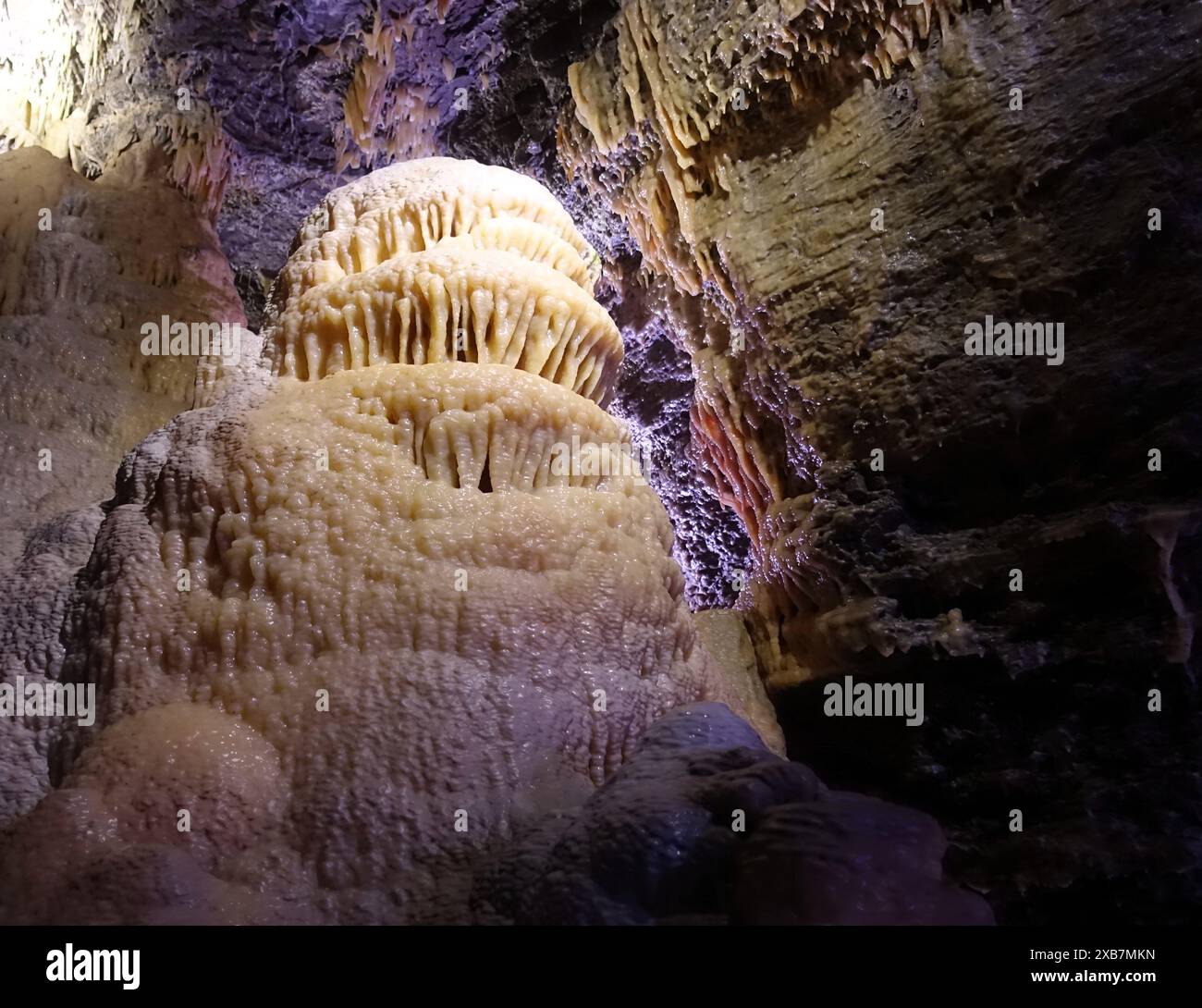 Salt formations inside a rock cave illuminated with dim lights Stock ...