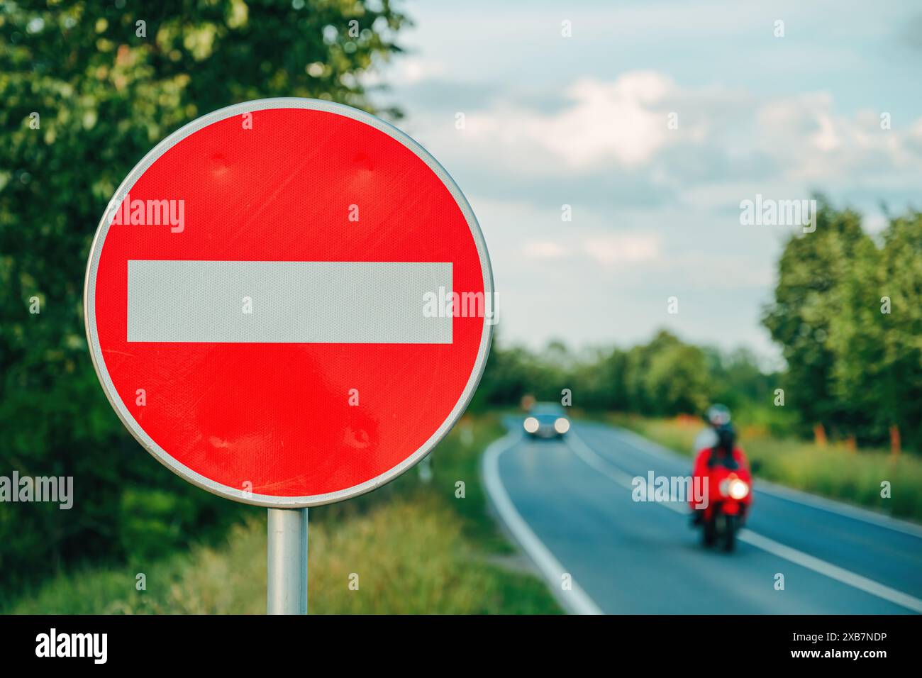 No Entry traffic sign by the european road with car and motorcycle ...