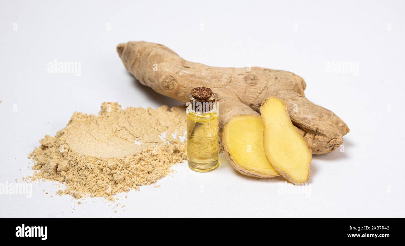 Spice ground ginger and ginger root on a white isolate background Stock ...