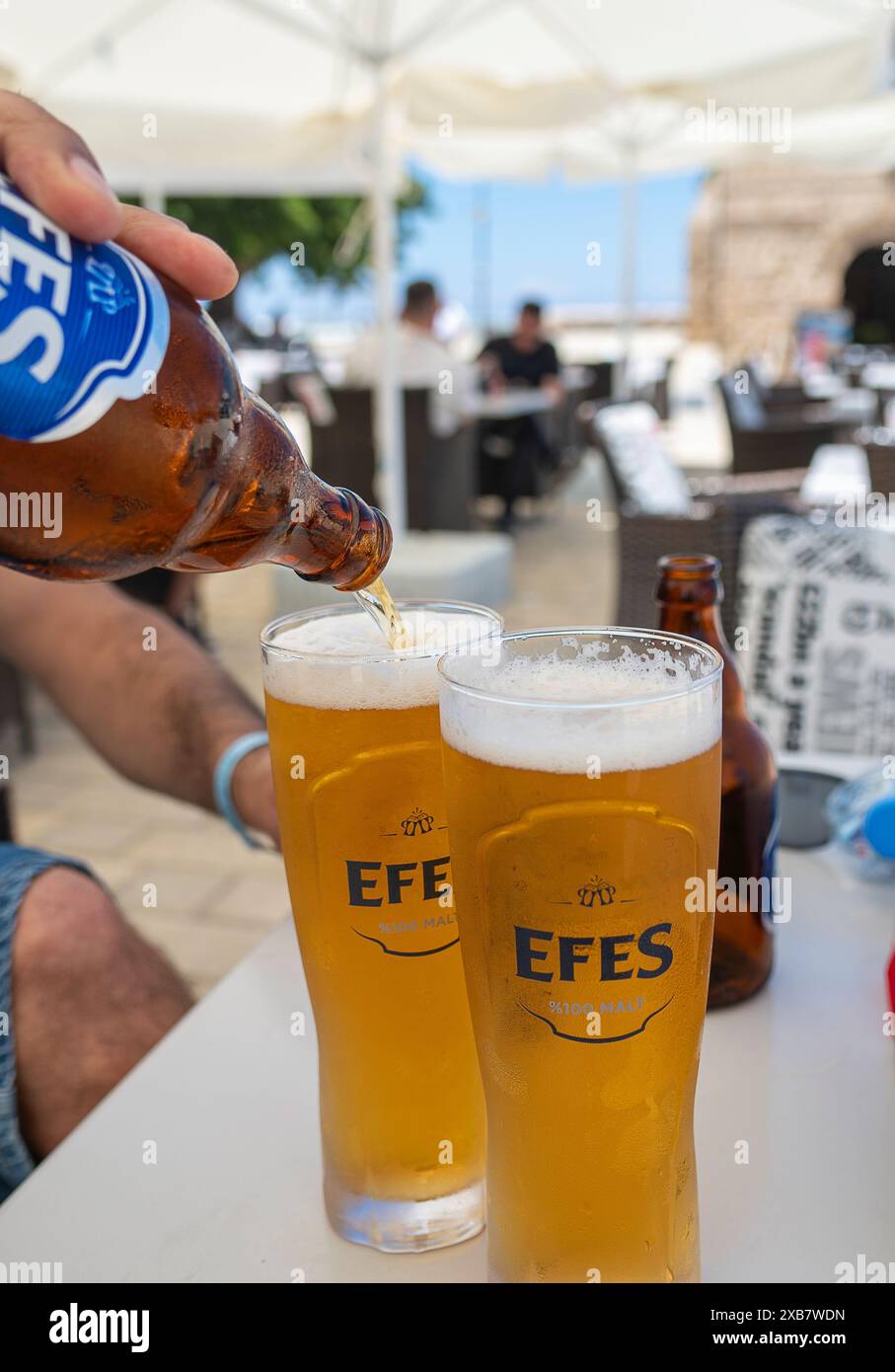 Girne, Kyrenia, Northern Cyprus- June 1, 2024 : Man Pouring Cold Beer ...