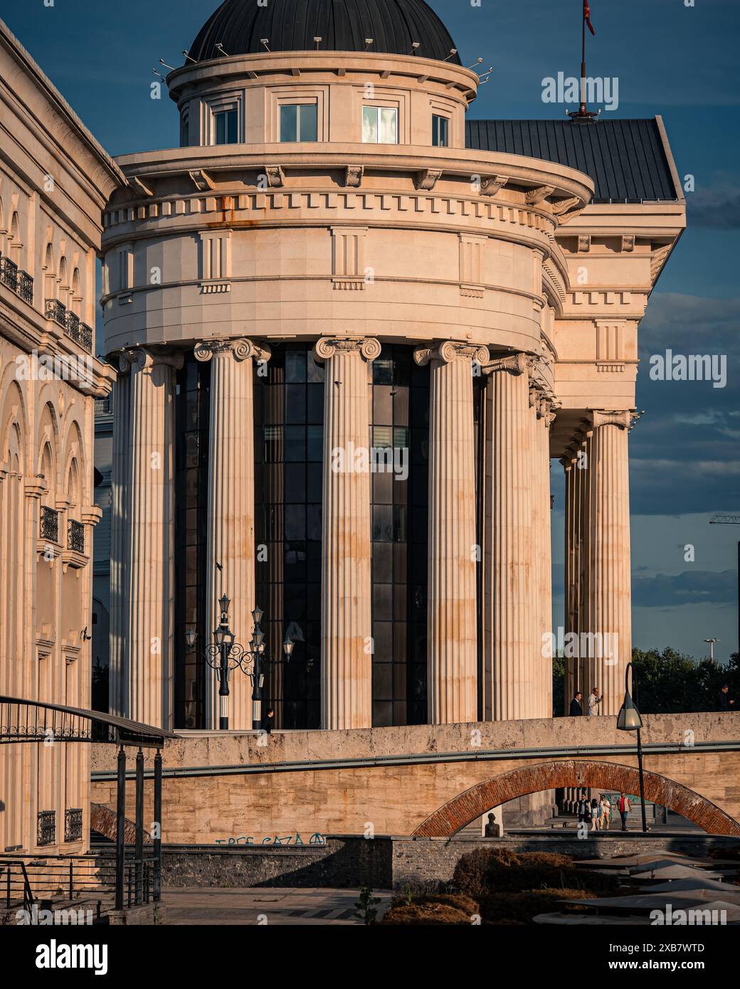 A grand building with an arched passage and a clock tower Stock Photo ...