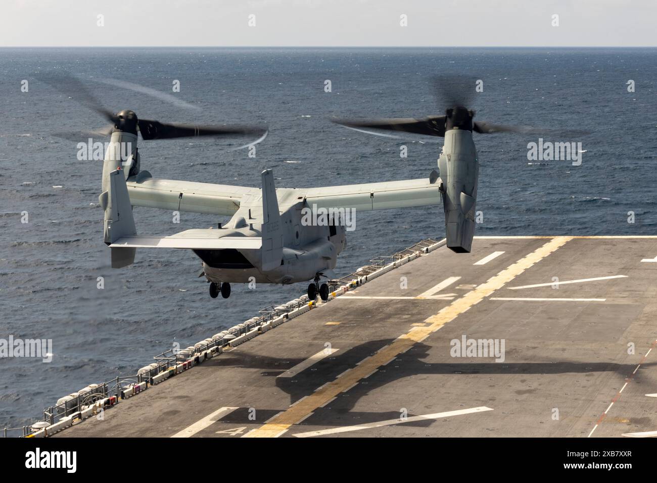 A U.S. Marine Corps MV-22B Osprey tiltrotor aircraft with Marine Medium ...