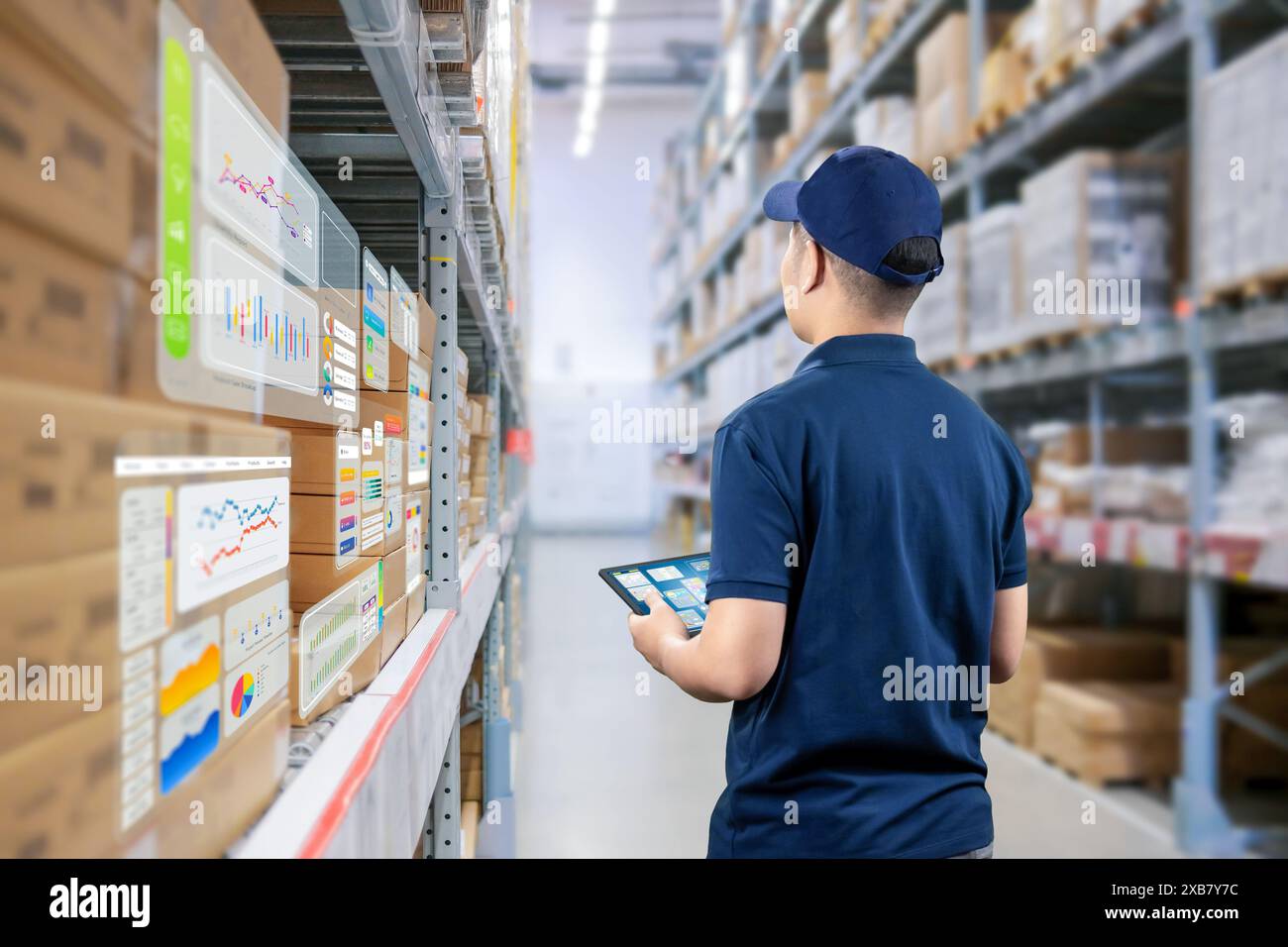 Asian worker or engineer in warehouse with stack of cardboard boxes ...