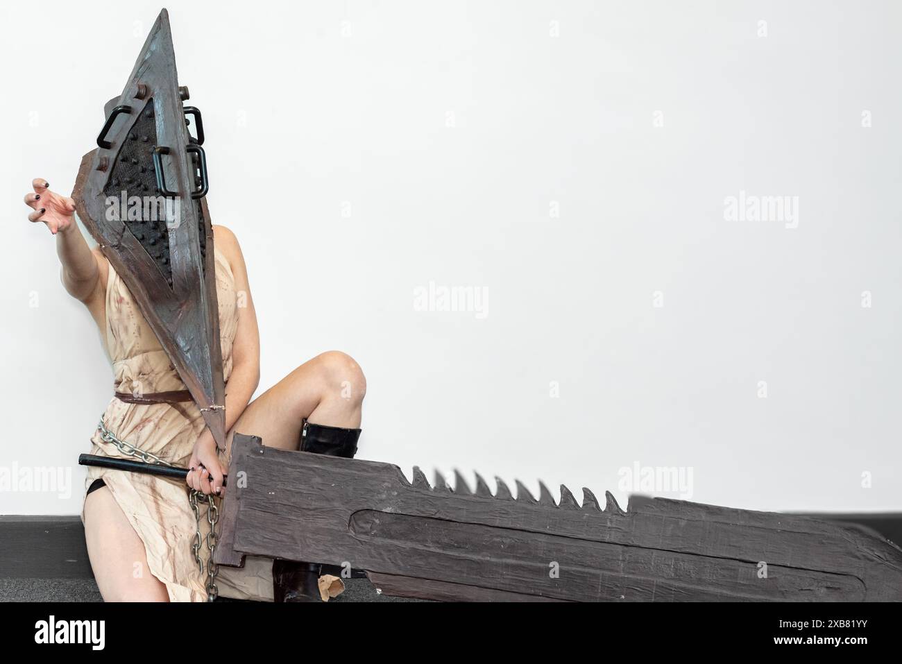 A female cosplayer in a horror character costume of Pyramid Head from ...