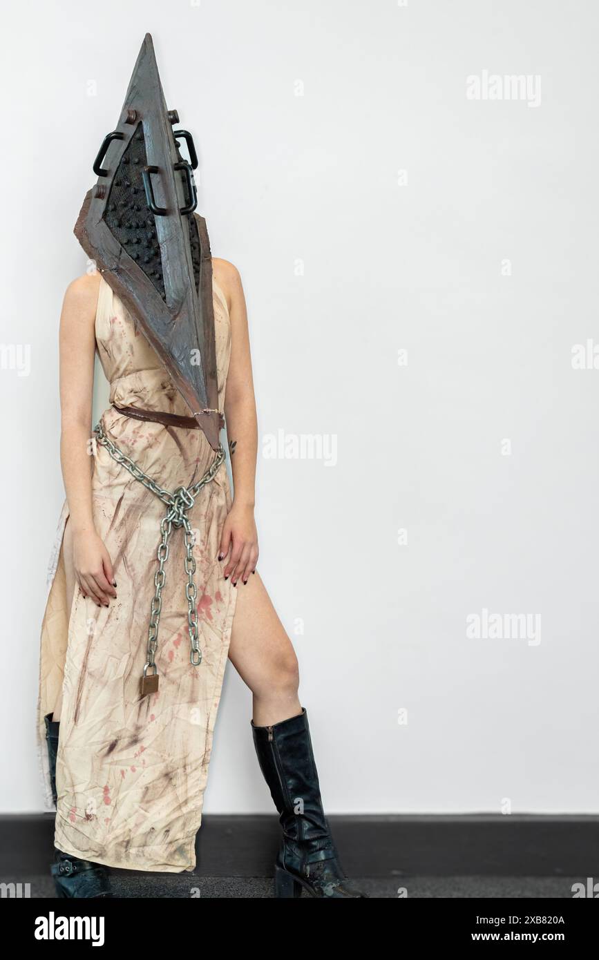 A female cosplayer in a horror character costume of Pyramid Head from ...