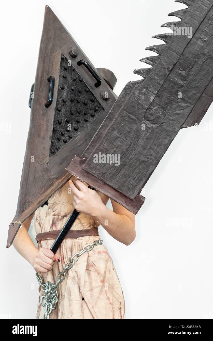 A female cosplayer in a horror character costume of Pyramid Head from ...