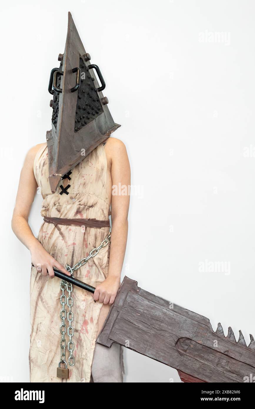A female cosplayer in a horror character costume of Pyramid Head from ...