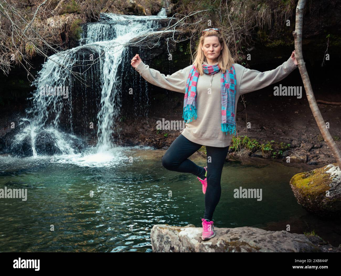 Woman yoga in front waterfall hi-res stock photography and images - Alamy