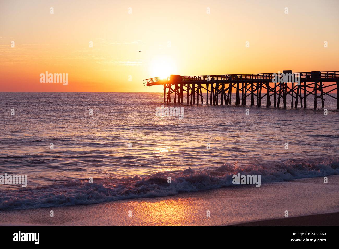 Peaceful sunrise over fishing pier hi-res stock photography and images ...