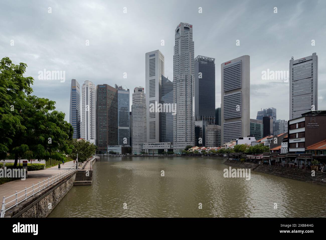A river flows through urban buildings and skyscrapers Stock Photo - Alamy