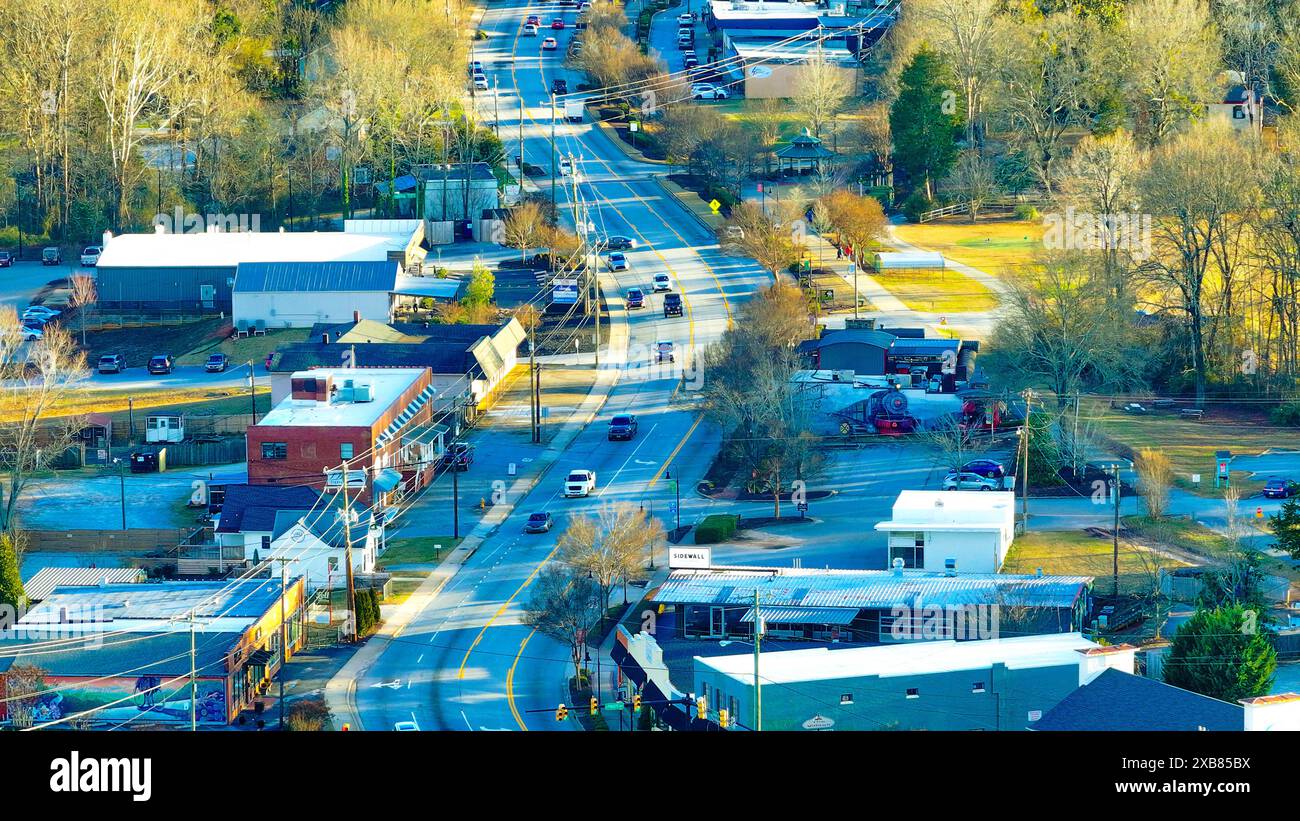 Aerial view of numerous cars driving on a suburban road Stock Photo - Alamy