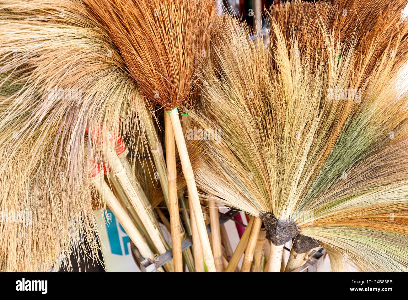 Brushes made from plant fibres on sale at roadside stall, Pakse, Laos ...