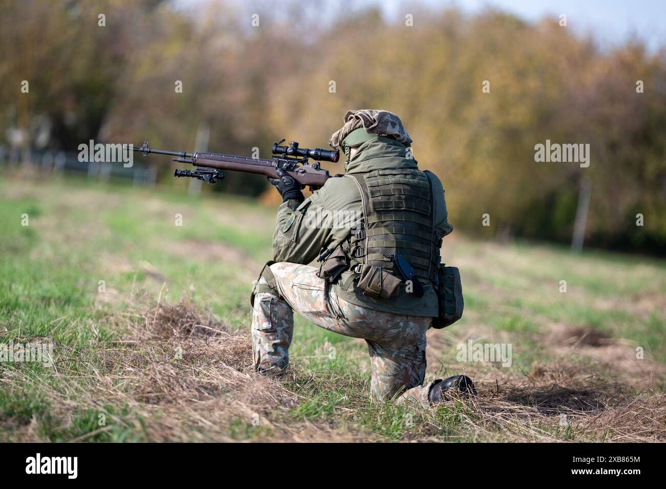 Holding a sniper rifle hi-res stock photography and images - Alamy