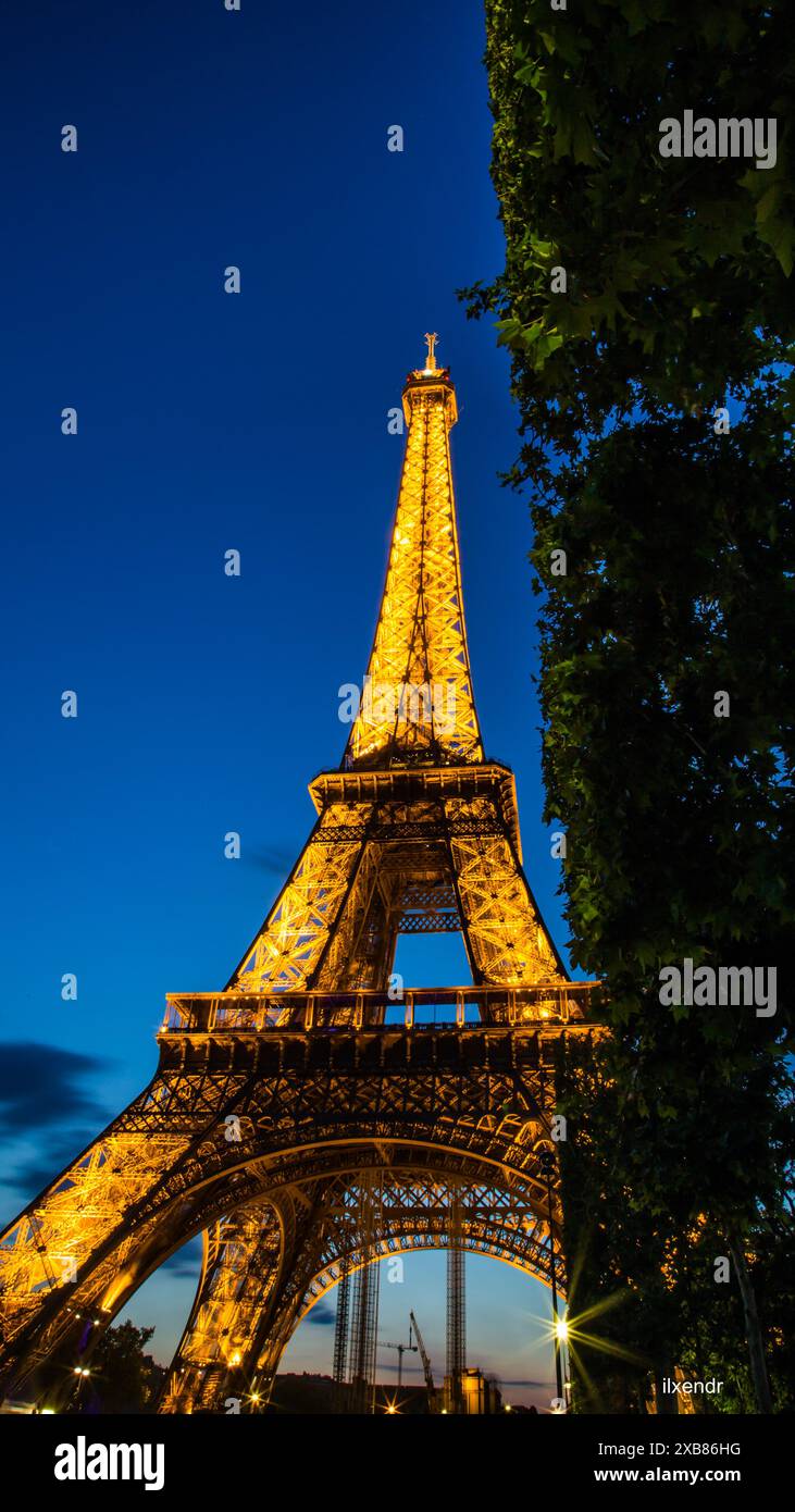 Nighttime illuminations of Paris's iconic Eiffel Tower in France Stock ...