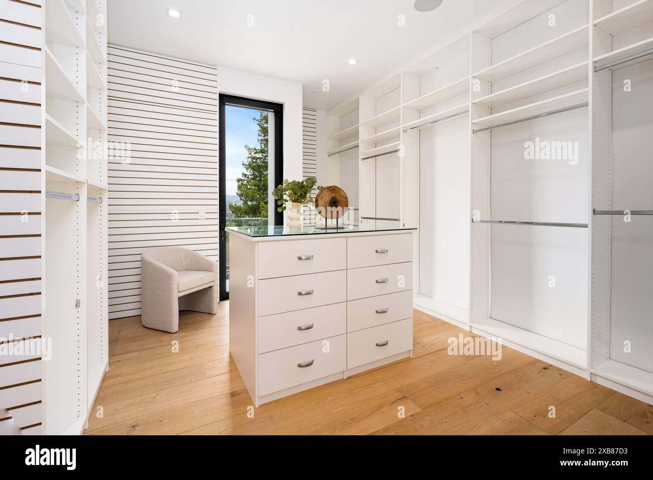 A wall-mounted storage unit with numerous cabinets and drawers ...